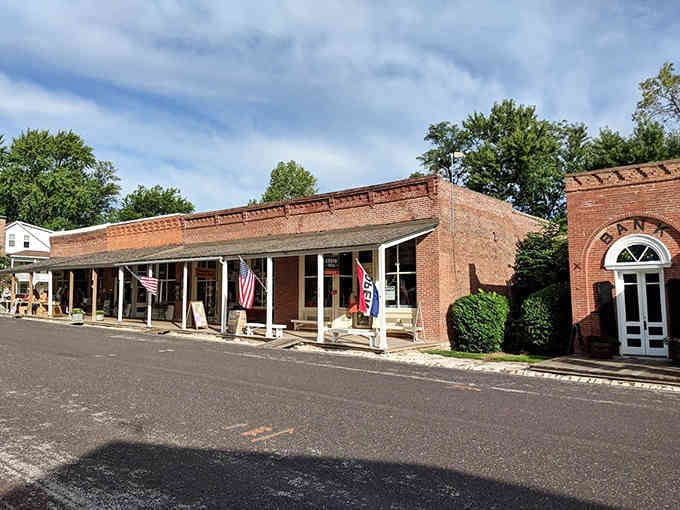 American flags flutter above covered walkways where locals gather at storefronts that have served generations of neighbors.