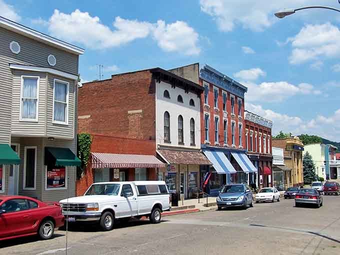 Striped awnings and colorful storefronts line up like a box of crayons that decided to become architecture instead.