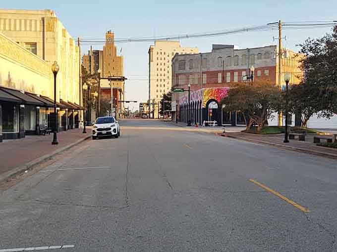 Golden hour light bathes the main street in warmth, highlighting architectural details often missed during daytime.