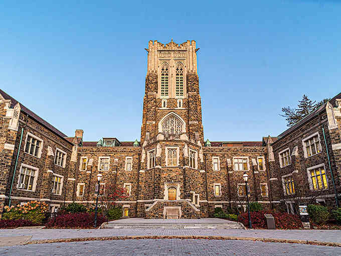 That Gothic tower stands proud against blue sky, looking like Hogwarts decided to set up shop in Pennsylvania.