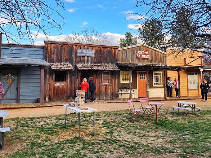 Weathered wooden buildings and dirt pathways transport you back to frontier days when cowboys roamed these lands.