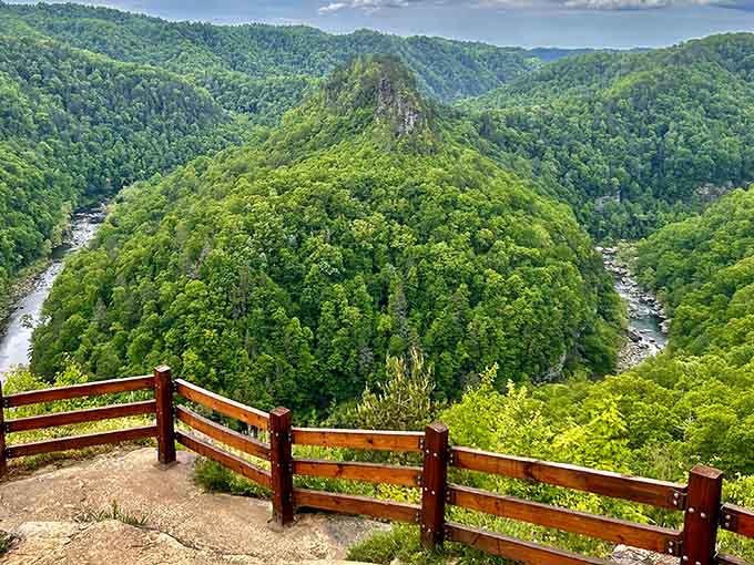 From this wooden overlook, the Russell Fork River carves through mountains like nature's own highway system, creating breathtaking vistas at every turn.