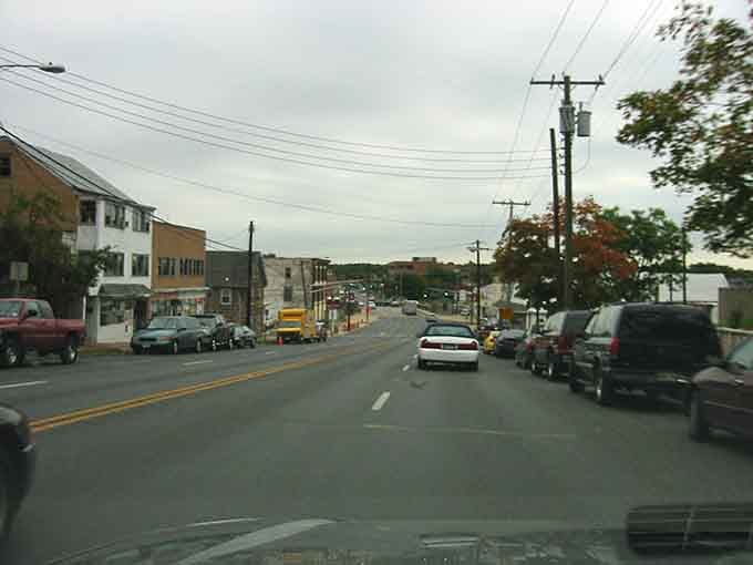 The open road ahead symbolizes possibility, and here that possibility includes actually affording to fill your gas tank regularly.