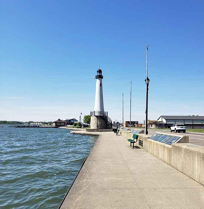 This waterfront beauty stands proudly along the pier, its stone base and white tower creating perfect symmetry.