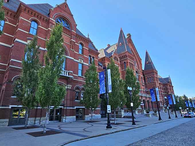 Red brick Victorian grandeur stretches along the street like a magnificent monument to nineteenth-century craftsmanship and civic pride.