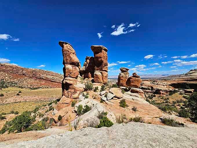 These rust-colored rock towers stand like sentinels in the desert, their bizarre shapes sculpted by millions of patient years.