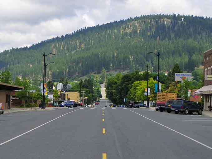 Main Street stretches toward forested mountains, offering that classic small-town view where life moves at a gentler pace.