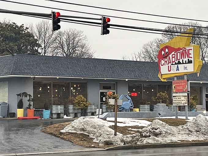 That vintage sign and cheerful crab sculpture announce you've found authentic Maryland seafood done right.