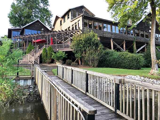 That wooden walkway over the water leads to the kind of dining experience where the view rivals the food.