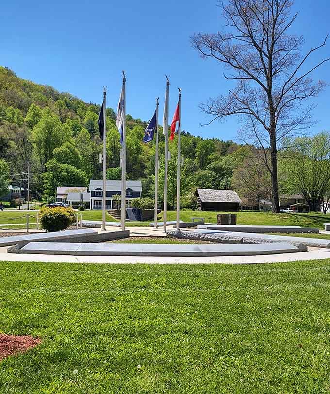 Flags wave proudly in the mountain breeze above this peaceful plaza where trails from everywhere converge here.
