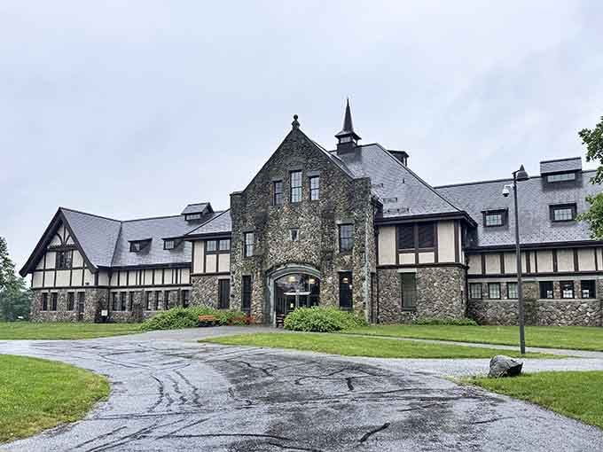 This Tudor-style mansion with its stone towers and timber accents belongs in the English countryside, not central Jersey.