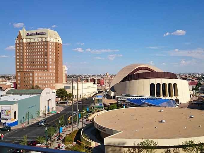 Modern mixed-use buildings with shaded trees show how desert cities can stay cool and inviting, blending residential comfort with street-level shopping.
