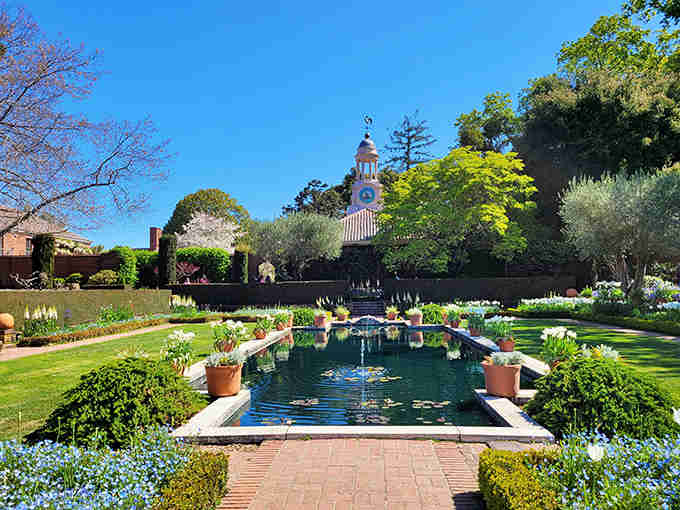 This reflecting pool mirrors perfection with its manicured lawns and that charming clock tower peeking through the trees.