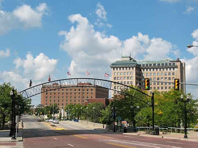 The decorative arch frames downtown like a welcome sign, inviting you to explore streets where history and progress shake hands daily.