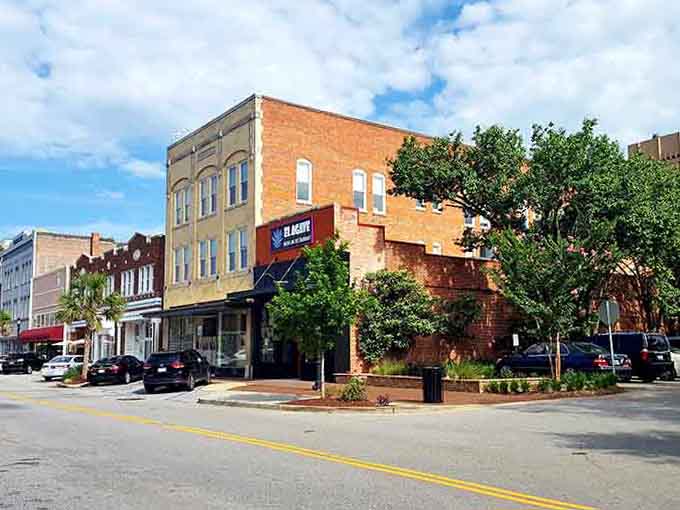 Classic brick storefronts line quiet streets where you can still park right in front and shop like it's 1955.