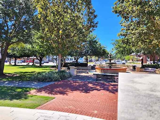 This town square with its fountain and brick pathways invites you to sit, relax, and watch life unfold.