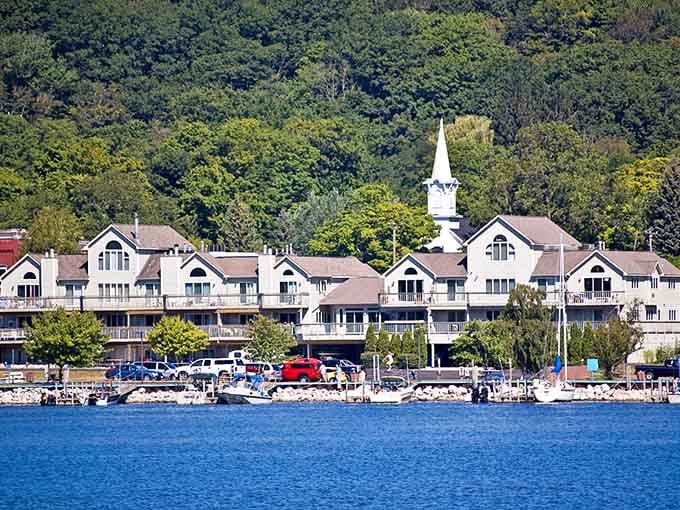 That marina stretches toward the horizon where blue water meets endless sky in perfect summer harmony.