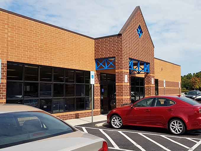 Those distinctive blue diamond windows add architectural charm to your budget-friendly shopping destination, like Downton Abbey meets discount shopping.