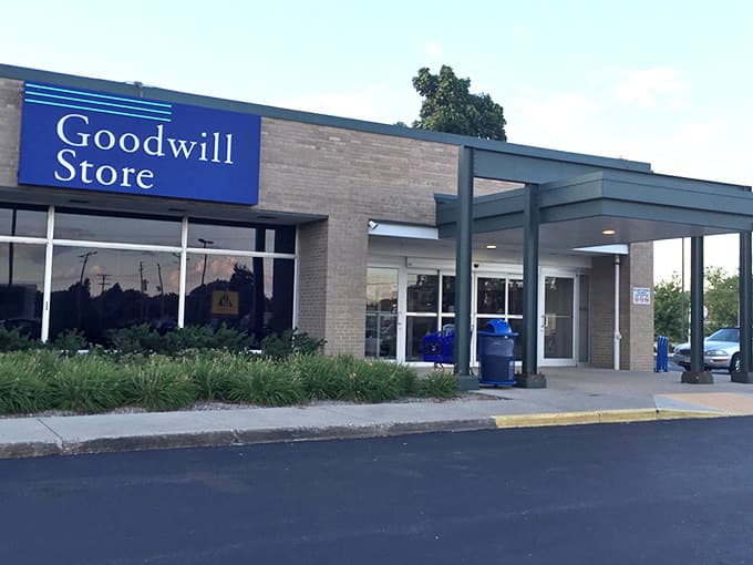 The familiar blue Goodwill sign welcomes bargain hunters to this outlet where deals are weighed, not priced.