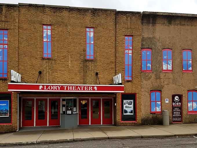 The Lory Theater's vintage marquee and colorful windows promise entertainment that brings the whole community together inside.