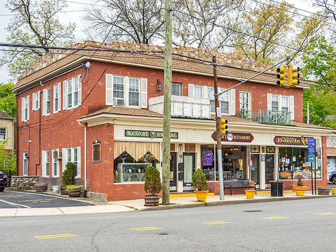 Classic brick storefronts with white trim exude small-town American charm that feels both timeless and welcoming to all.