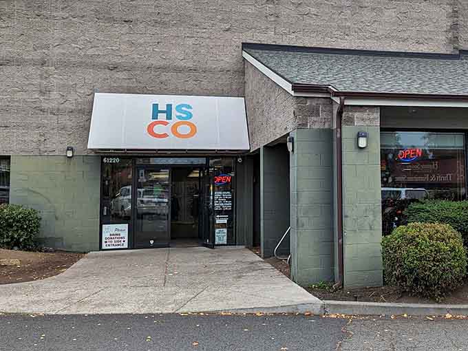 The simple HSCO sign and clean storefront prove that great thrift stores don't need flashy marketing, just good merchandise.