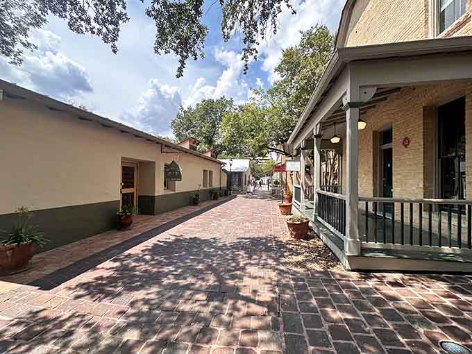 Brick pathways wind through shaded courtyards where Spanish colonial architecture creates peaceful retreats from modern city life.