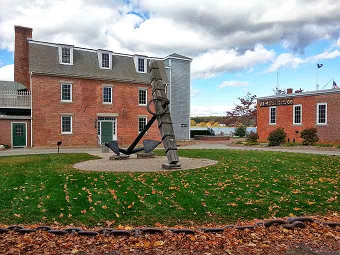 Historic brick buildings and a striking anchor sculpture welcome visitors to this living museum of New England's seafaring heritage.