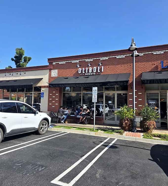 Modern brick facade and outdoor seating invite donut lovers to linger over organic-flour treats and quality coffee.