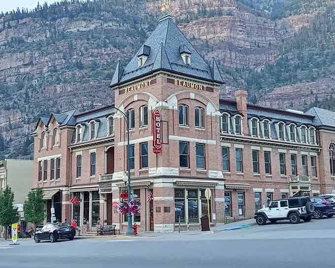 The Beaumont Hotel's turrets reach skyward like a Victorian castle guarding this mountain town's main street.