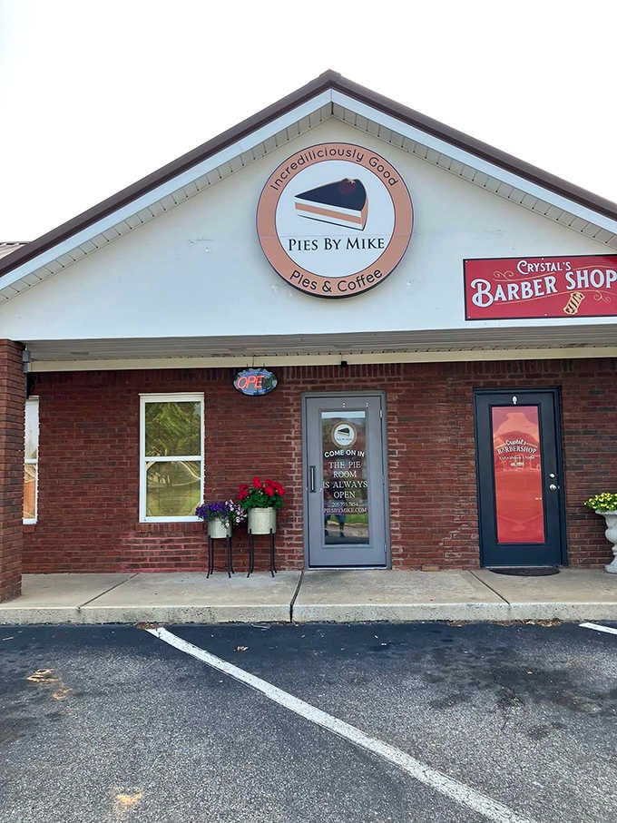 The simple brick storefront with its round logo and flower pots radiates small-town charm where pie-making is practically an art form.