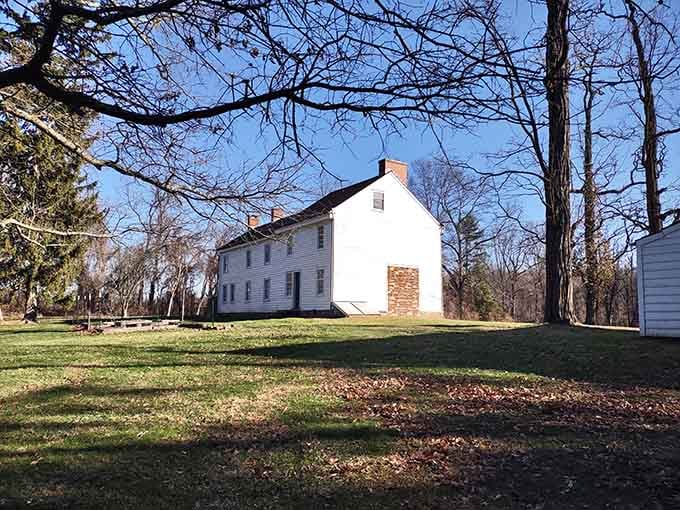 The simple white colonial building sits peacefully on green grass, belying the fierce battle that raged across these grounds.
