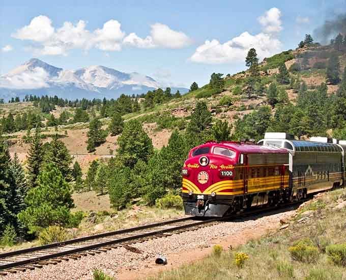 That sleek red diesel cutting through wide-open country with snow-capped peaks watching&mdash;this is Big Sky thinking at its finest.