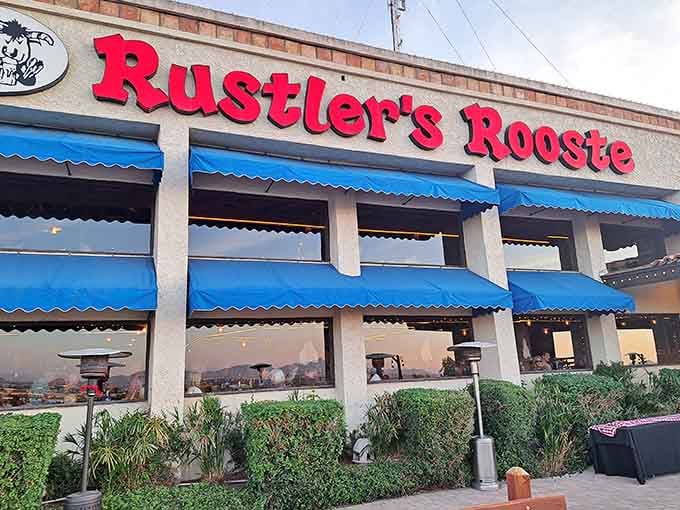 Those cheerful blue awnings shade diners enjoying cowboy cuisine with spectacular views all around them at dusk.