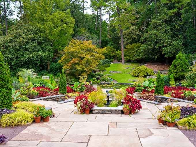 Terraced gardens burst with crimson blooms and golden foliage, creating layers of color that would make Monet jealous.