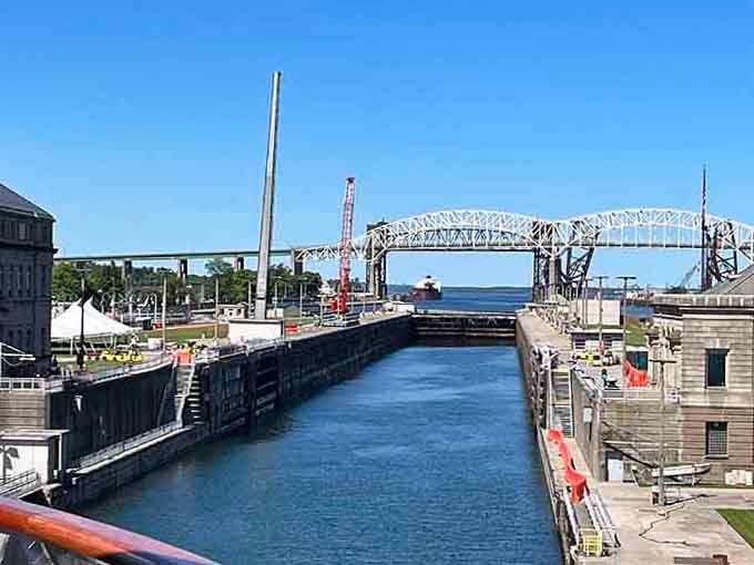 Engineering marvel meets Great Lakes shipping as massive vessels navigate through these historic water elevators with precision.