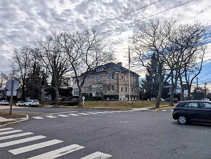 Historic stone architecture framed by winter trees creates a scene that belongs on a classic American postcard.