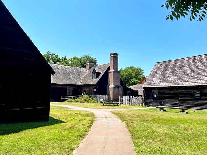 Colonial-era buildings stand along a sunny path where America's earliest settlers built their dreams from scratch and sheer determination.
