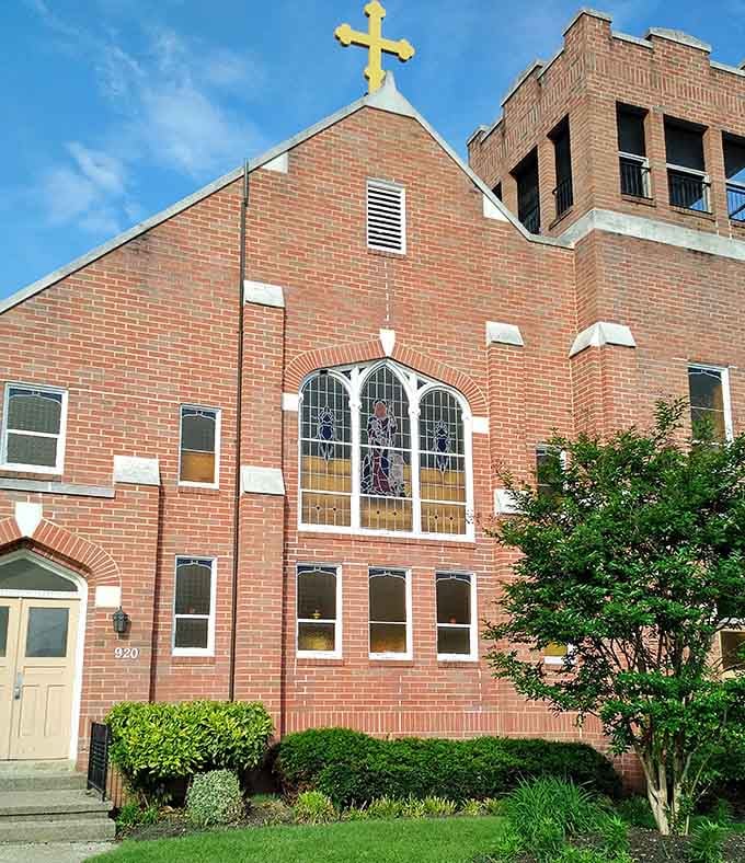 The golden cross gleaming against brick speaks to traditions carried lovingly across oceans and generations of faithful families.