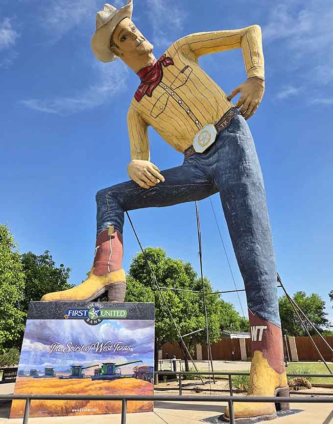 Tex's yellow shirt and red bandana pop against blue skies as he casually leans on one hip.