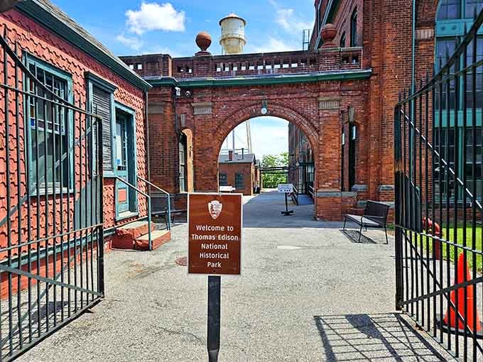 Historic brick archways frame the entrance where countless inventions were born, a portal into America's innovative past.