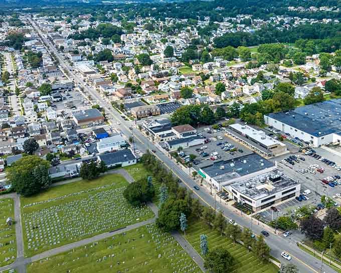 From above, this town reveals its perfect blend of green spaces, local businesses, and residential charm.