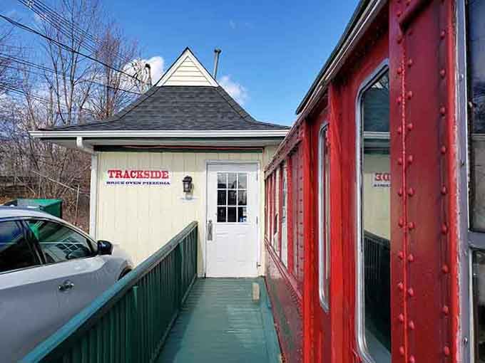 All aboard the flavor express - this vintage red train car serves pizza with more character than most Hollywood actors.