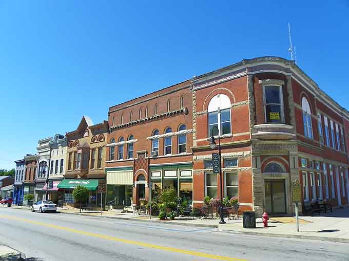 That rounded corner building with its tower shows architectural flair from an era when details truly mattered.
