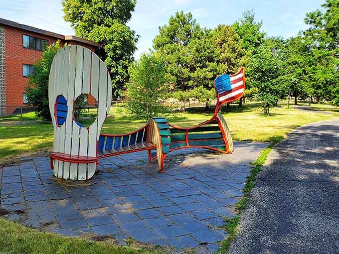 Playful skull and flag sculptures bring Day of the Dead vibrancy to neighborhood green spaces cheerfully.