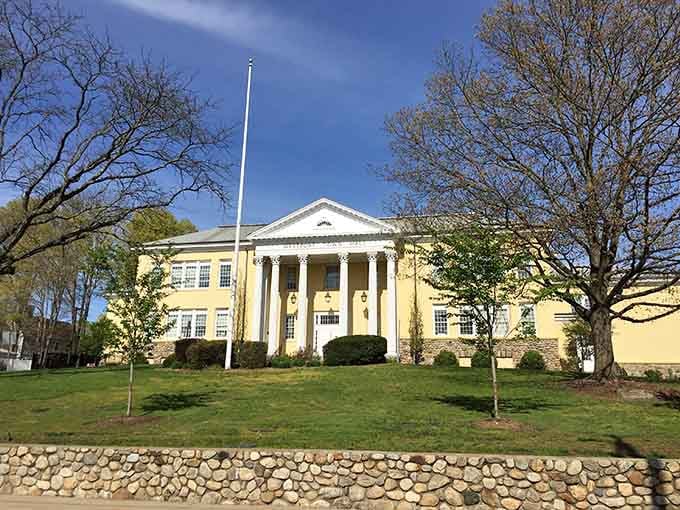 Sunny yellow walls and white columns give this building a cheerful Southern mansion vibe up north.