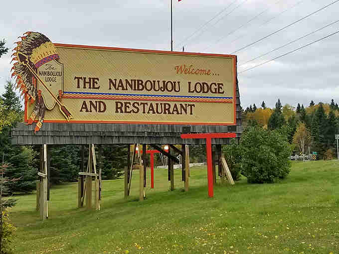 The vintage roadside sign with its colorful Native American headdress beckons travelers to discover this North Shore treasure.