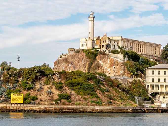 The lighthouse beacon still stands watch over "The Rock," where cell blocks and isolation created one of history's most infamous prisons.