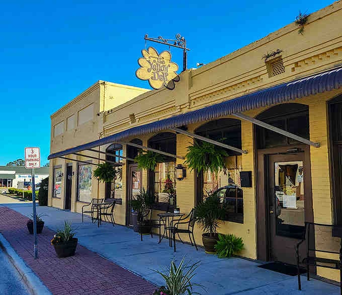 That cheerful yellow storefront practically smiles at you, promising good times and even better company inside.