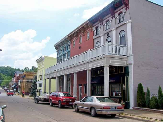Second-story balconies overlook the street, perfect for waving at neighbors like you're the mayor of your own movie set.